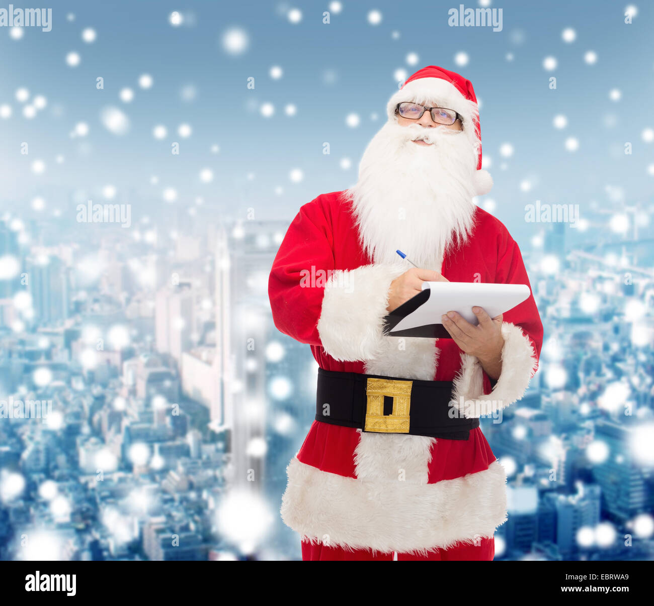 man in costume of santa claus with notepad Stock Photo - Alamy