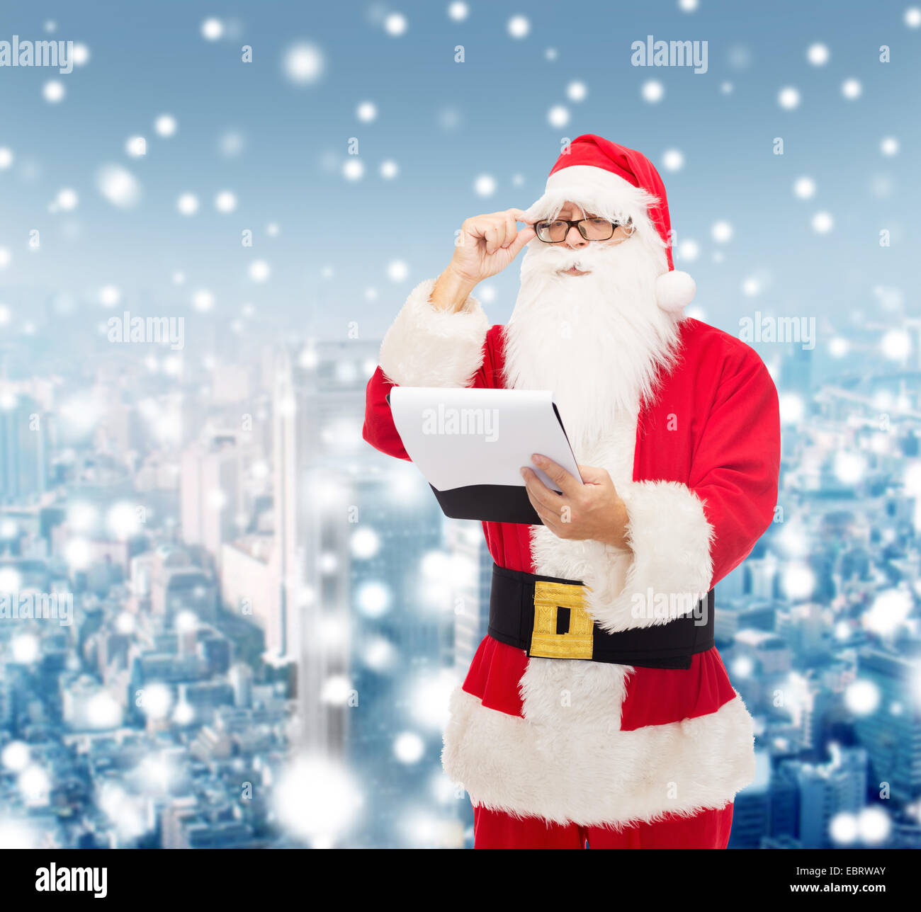 man in costume of santa claus with notepad Stock Photo - Alamy