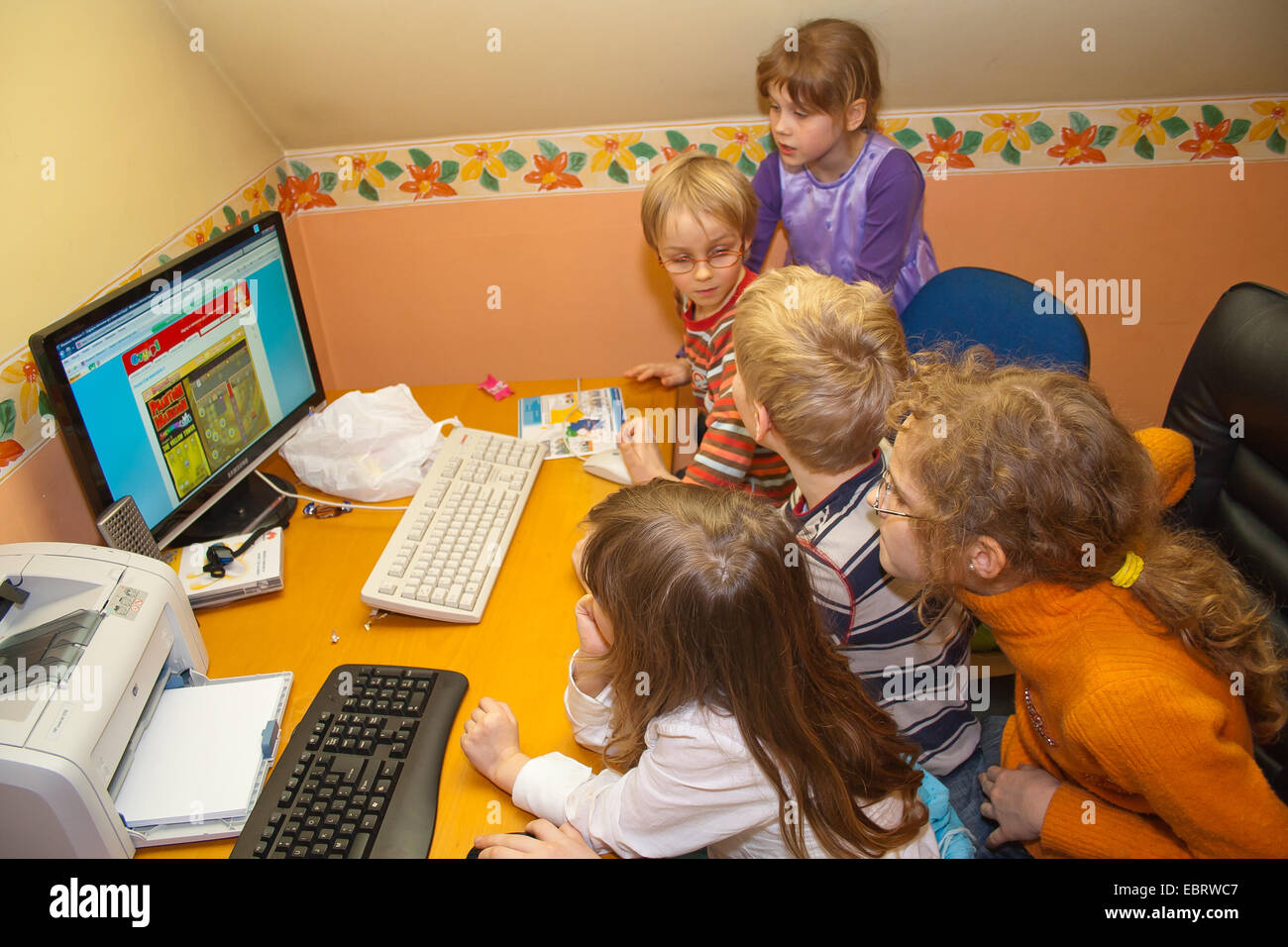 Group of a small children sitting in front of computer Stock Photo - Alamy
