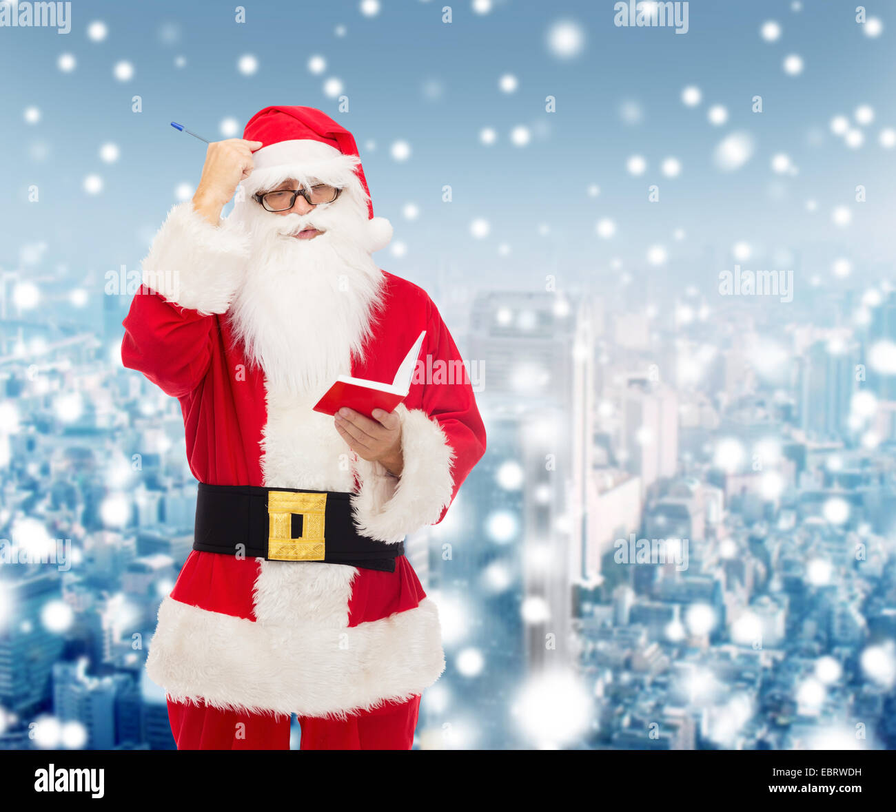 man in costume of santa claus with notepad Stock Photo - Alamy