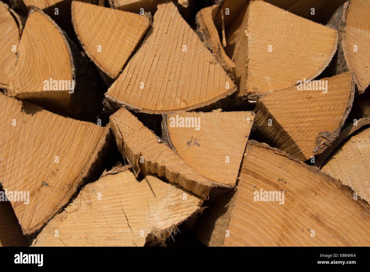 Split logs ready for burning Stock Photo - Alamy