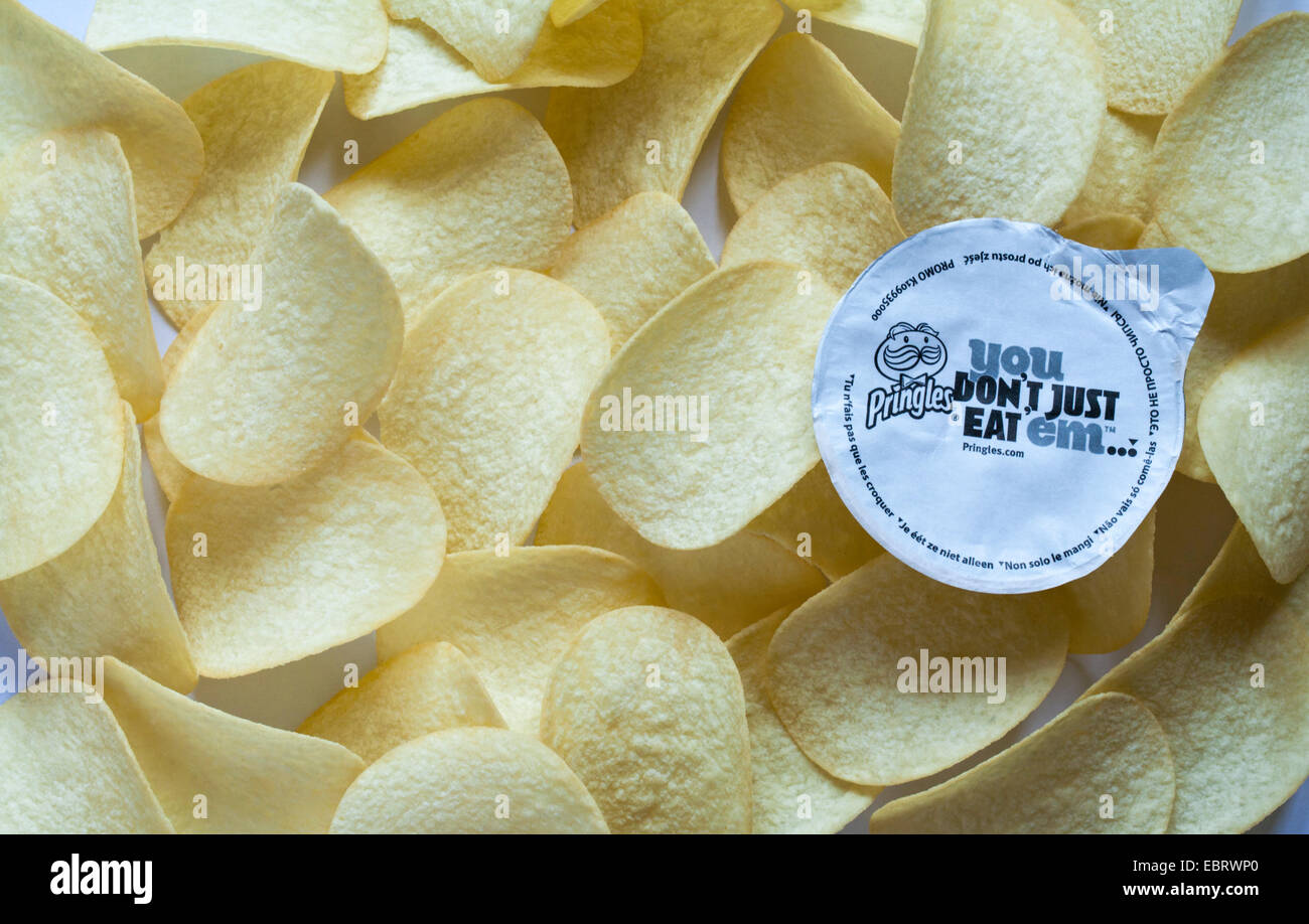 Spread of Pringles Original with contents spilled and foil lid you don ...