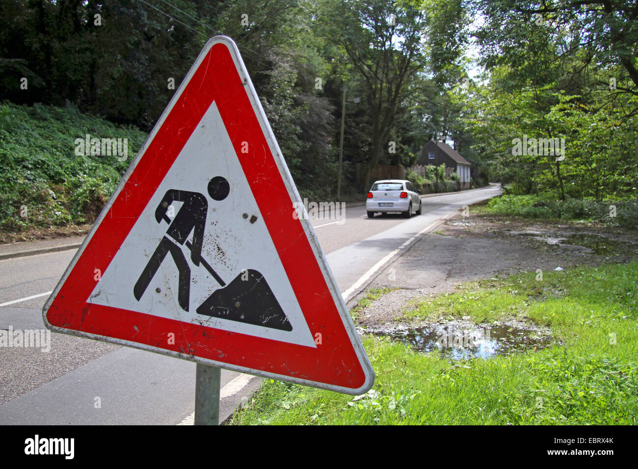 working sign on the roadside, Germany Stock Photo - Alamy