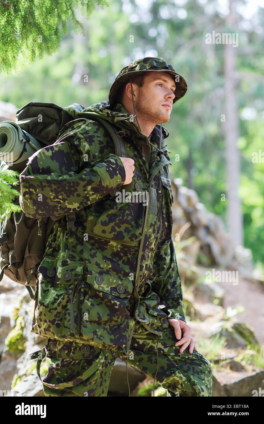 young soldier with backpack in forest Stock Photo - Alamy