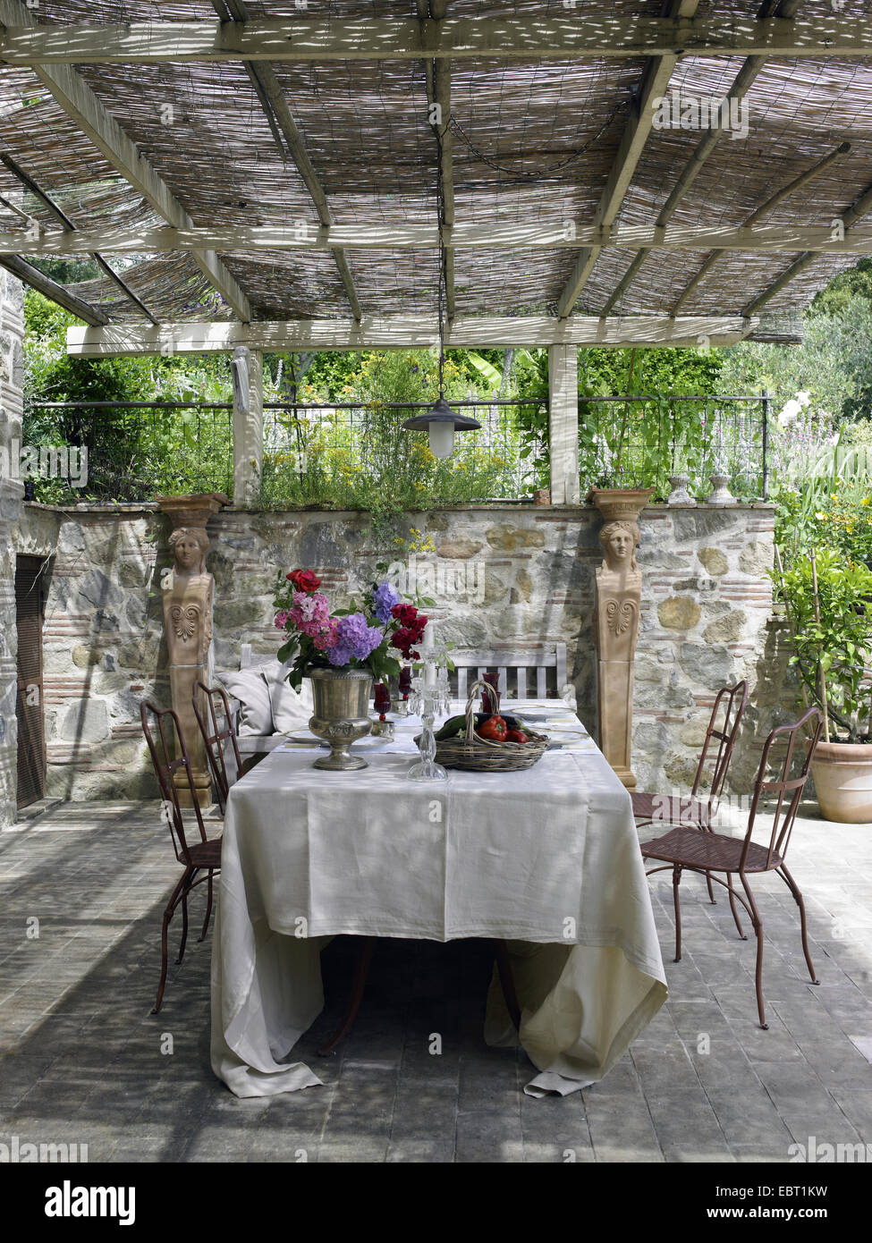 Table set in a patio in a house in the country side of Italy, Tuscany ...