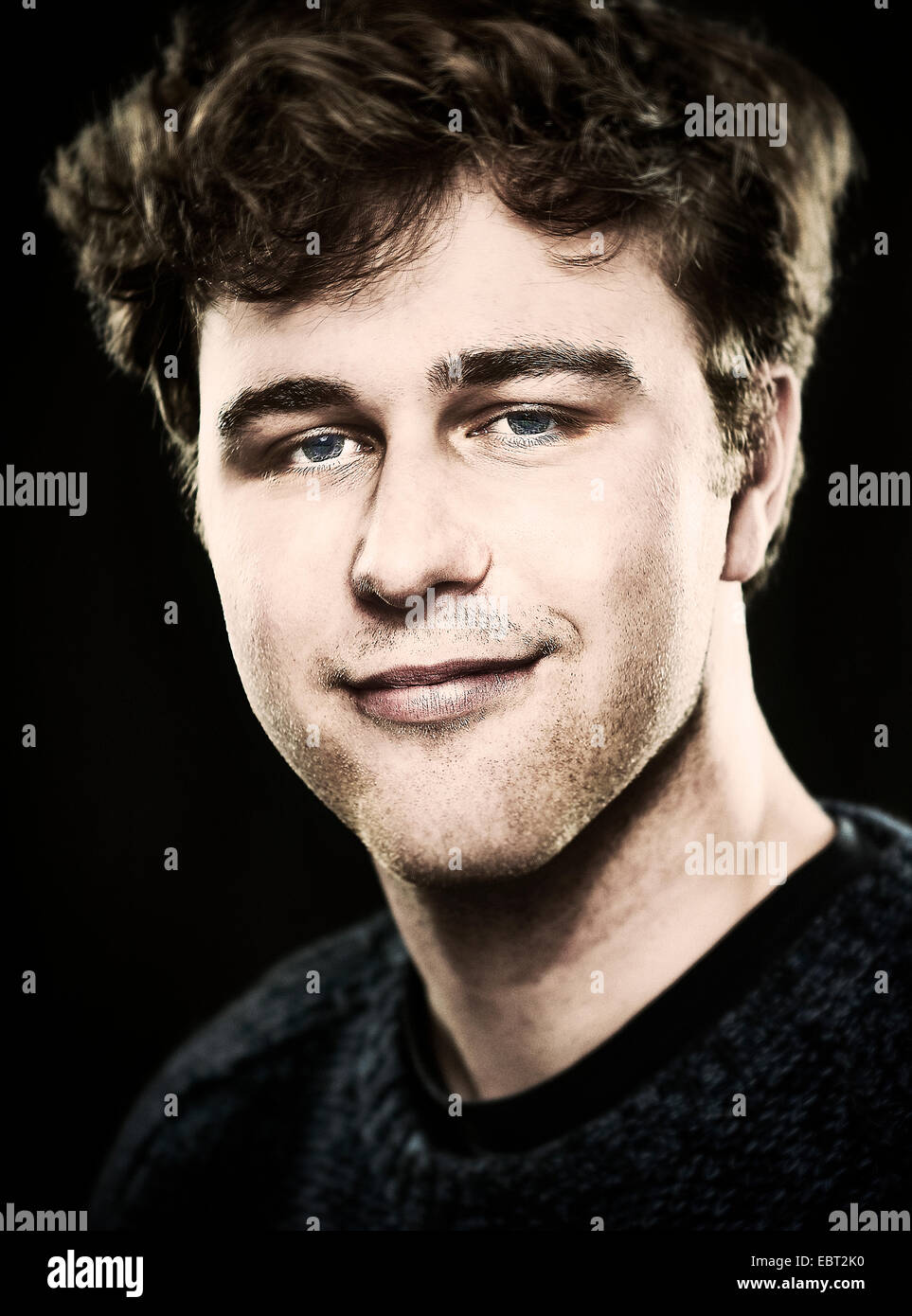 A photograph of a white European male age 19 shot in a studio against a ...