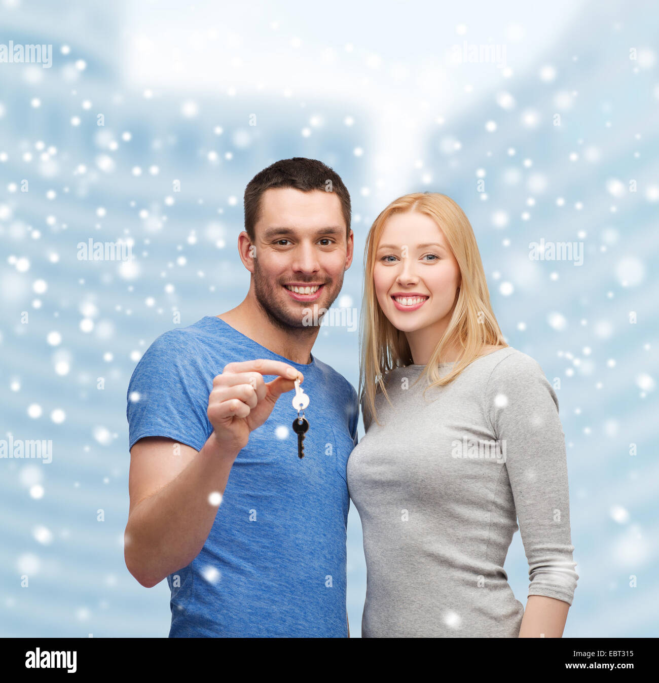 smiling couple holding keys Stock Photo - Alamy