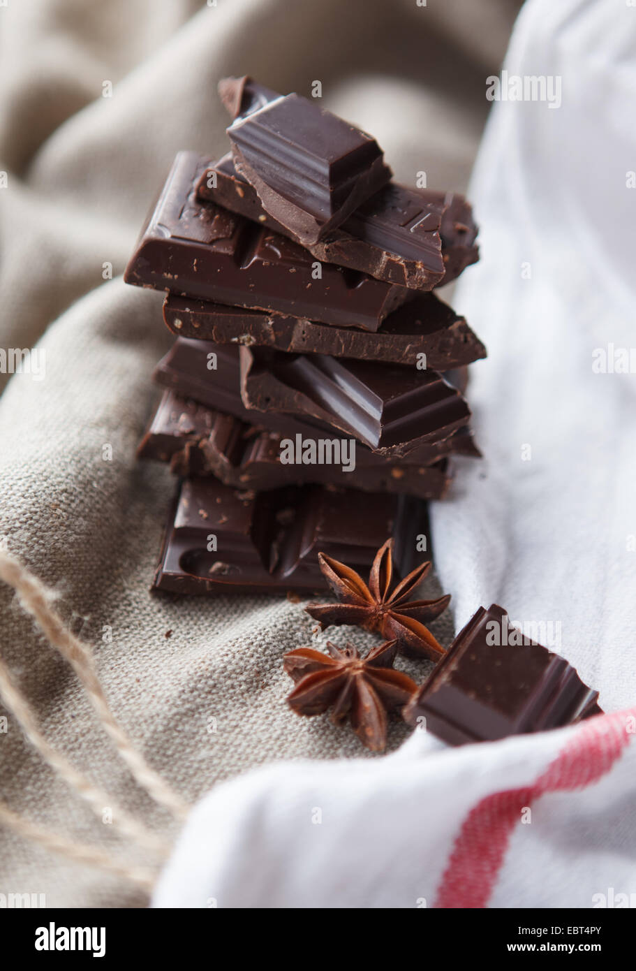 Broken chocolate bar and stars anise Stock Photo - Alamy