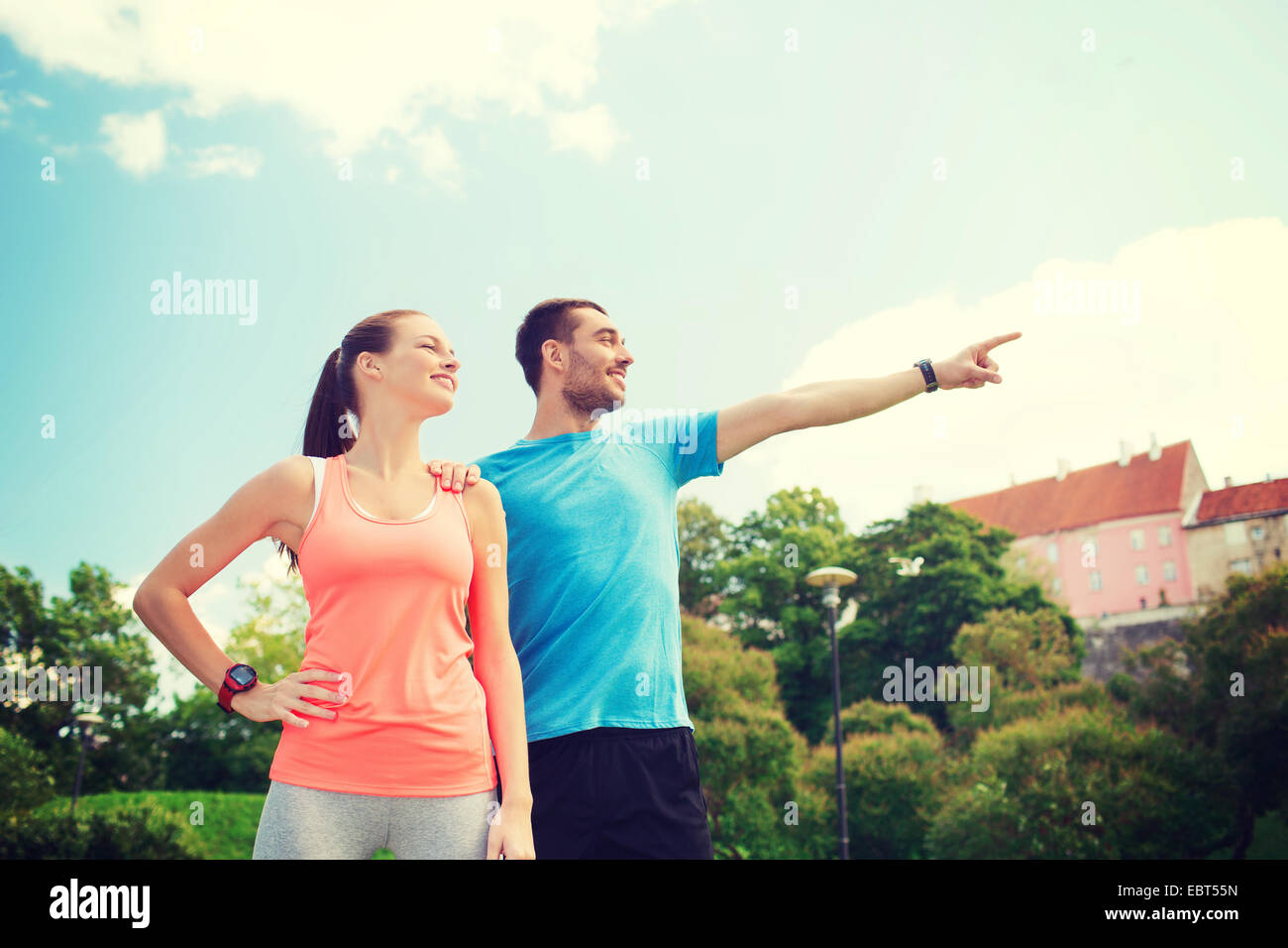two smiling people outdoors Stock Photo - Alamy