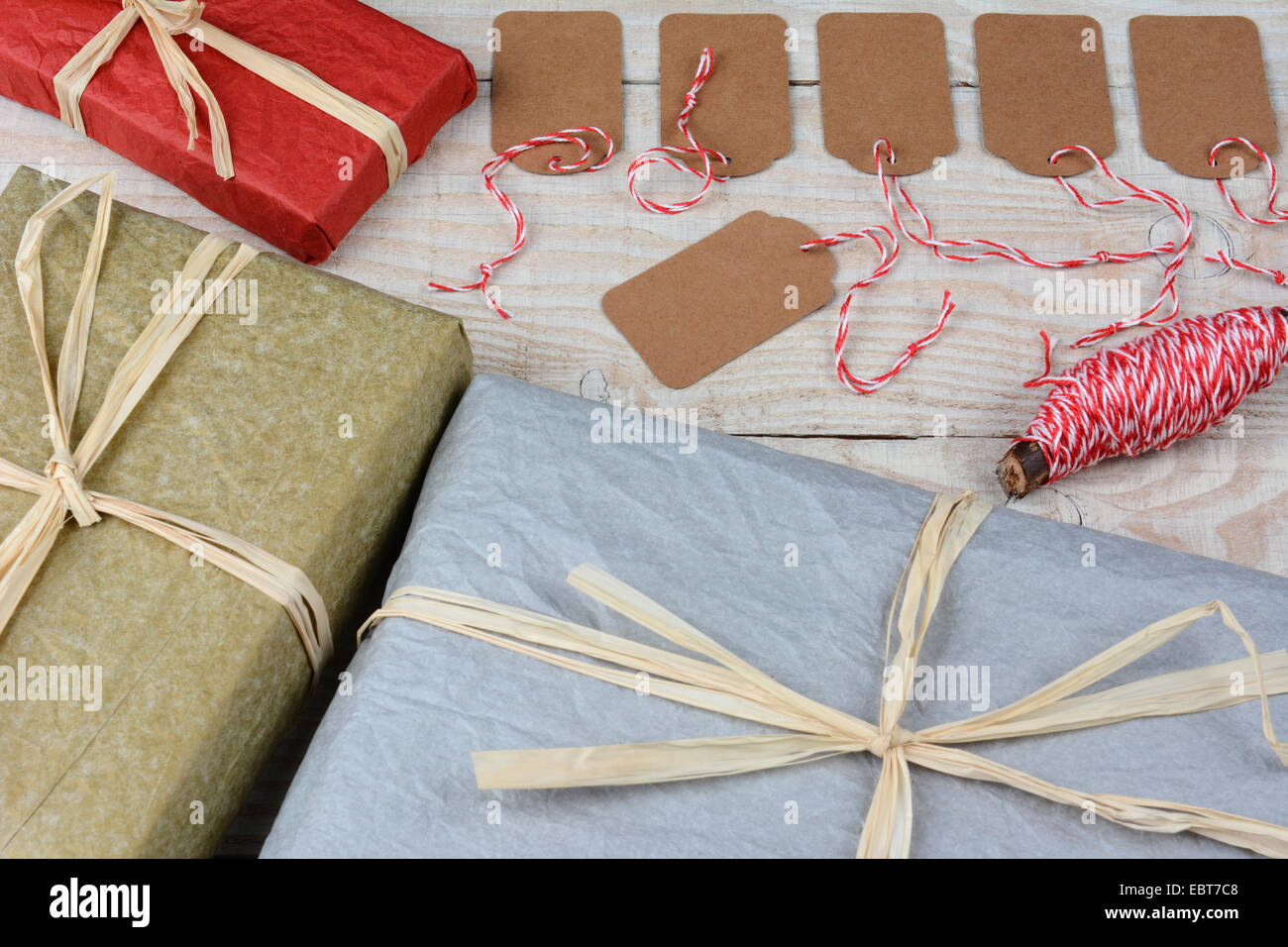 Overhead shot of a group of blank gift tags surrounded by wrapped ...