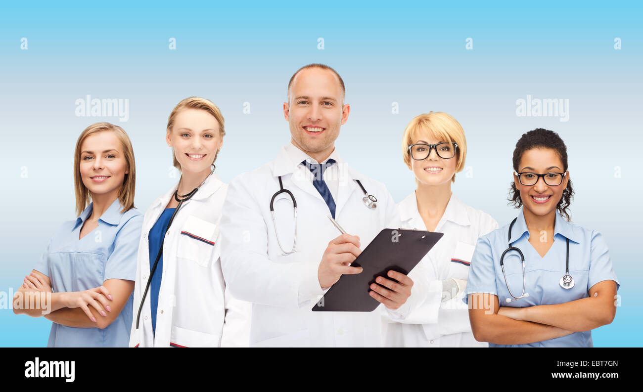 group of smiling doctors with clipboard Stock Photo - Alamy