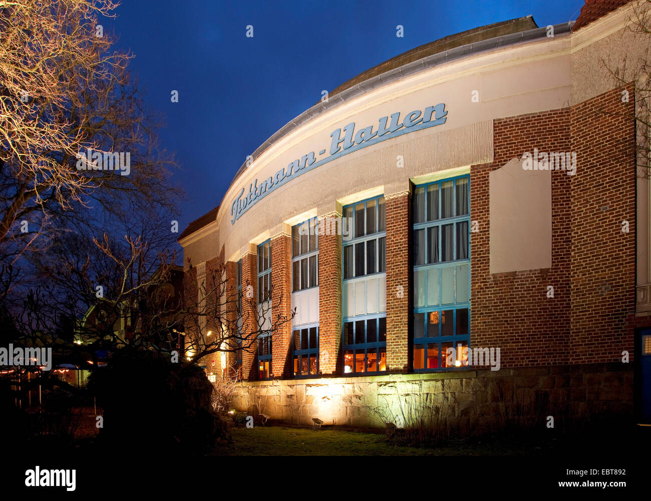 illuminated Flottmann-Hallen in twilight, Germany, North Rhine ...