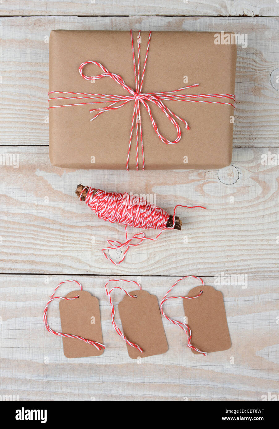 High angle shot of a Christmas Package wrapped in plain brown paper and ...