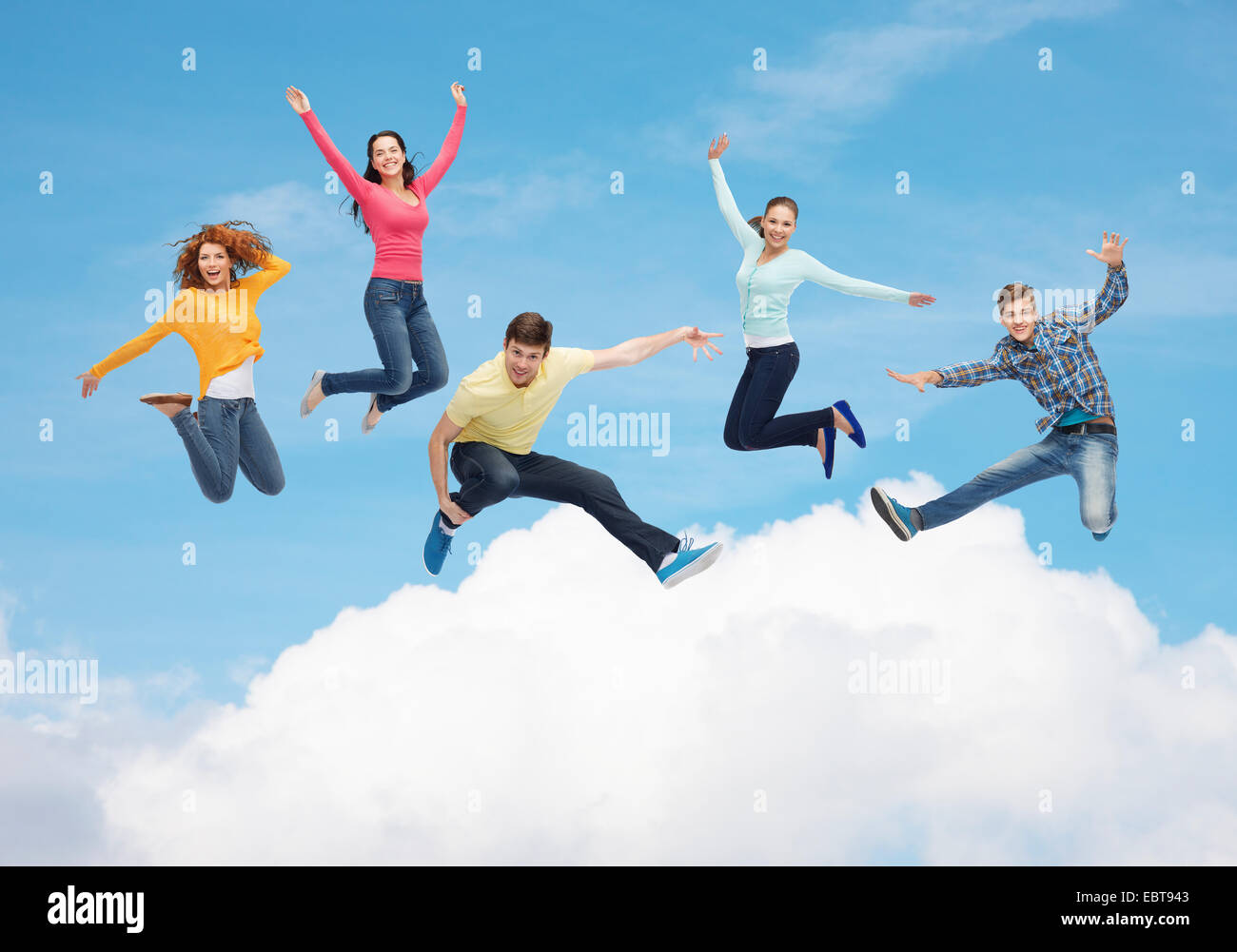 group of smiling teenagers jumping in air Stock Photo - Alamy