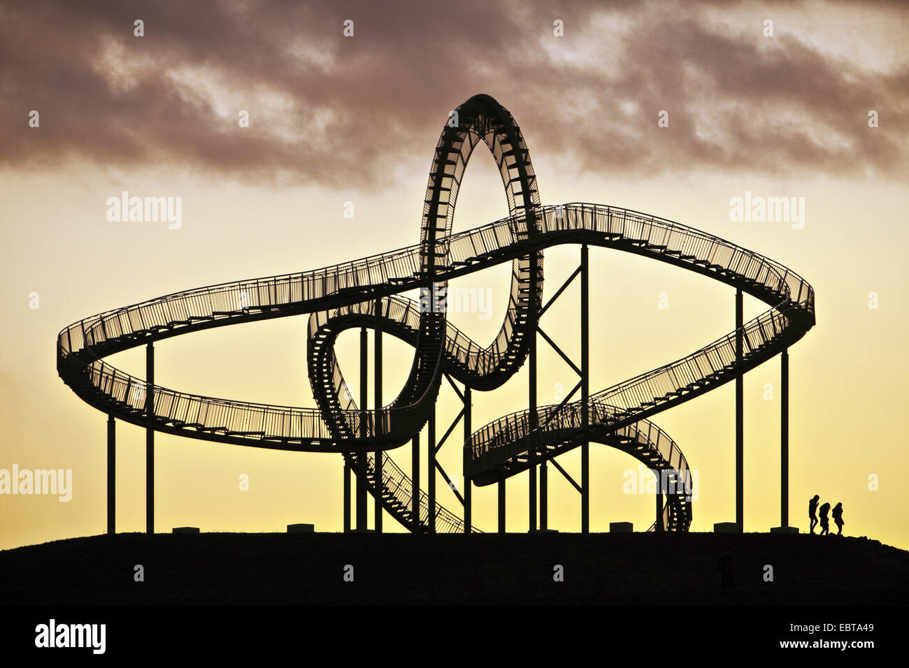 person on landmark Tiger and Turtle on stockpile Angerpark at sunset ...