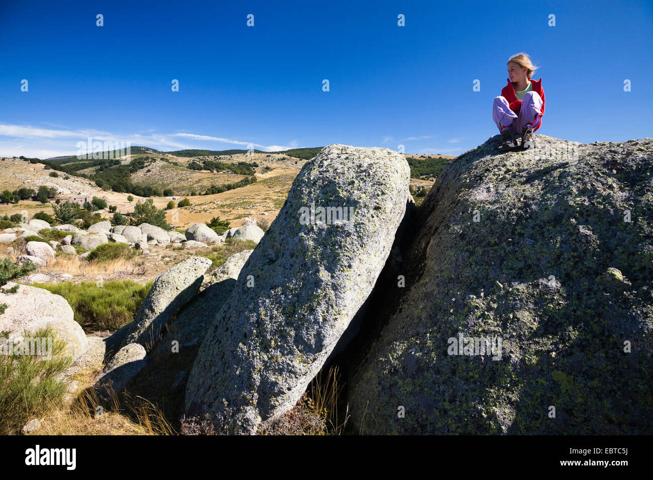 child crouching on rock, France, CÚvennes Stock Photo - Alamy