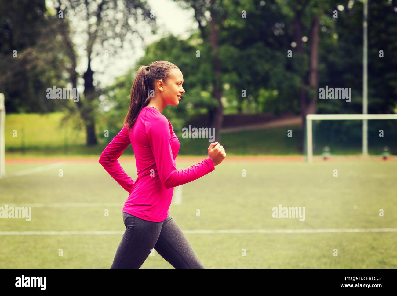 Running smiling field hi-res stock photography and images - Alamy