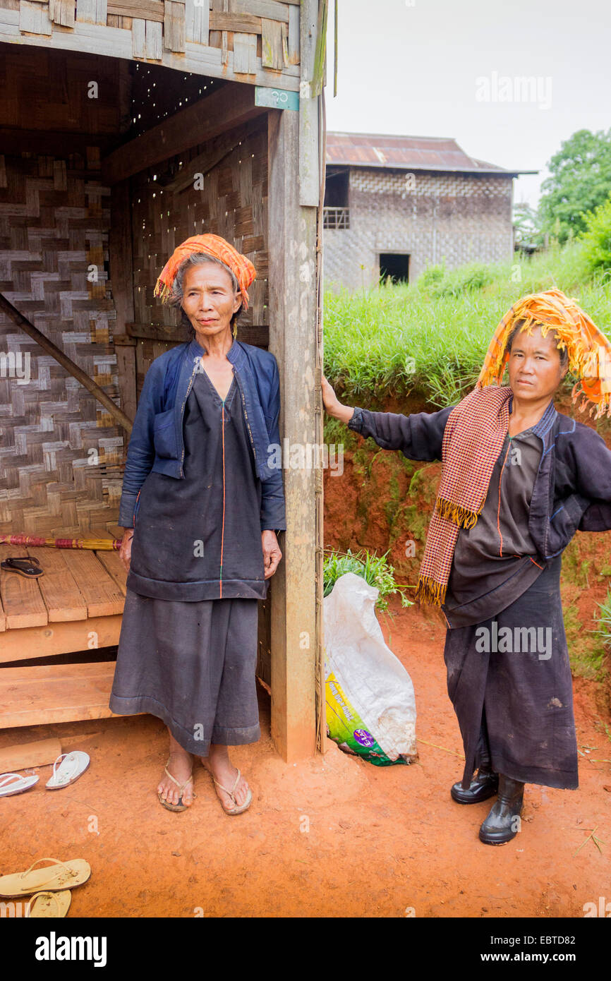 Two Pao, Pa-o women wearing the traditional indigo dress and bright ...