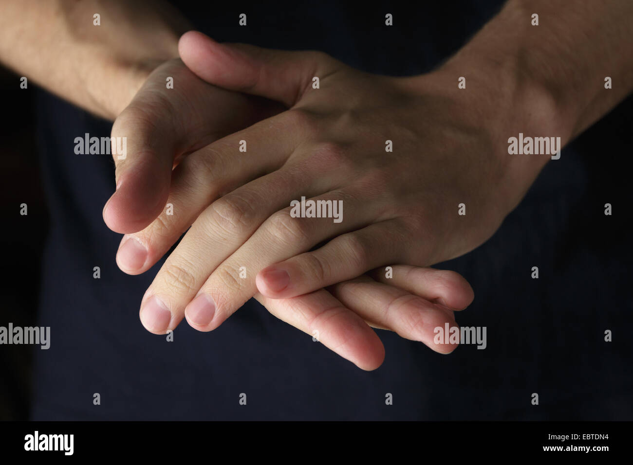Clasped fingers hi-res stock photography and images - Alamy