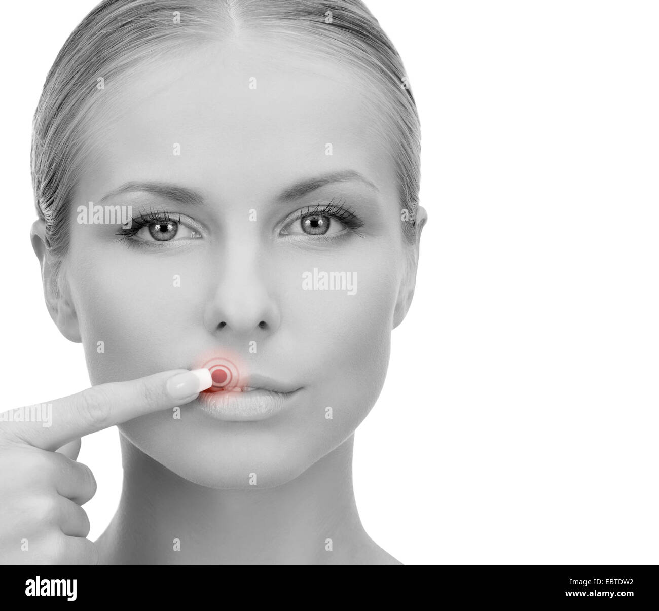 beautiful young woman pointing finger to her lips Stock Photo - Alamy