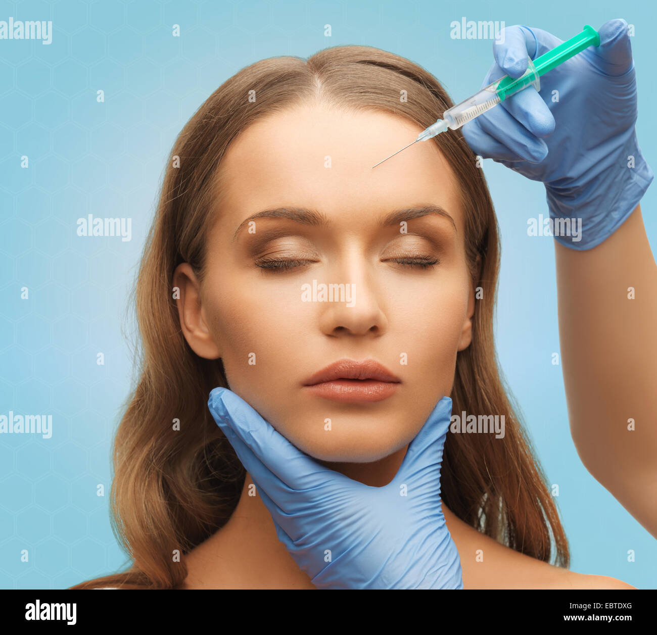 beautiful woman face and hands with syringe Stock Photo - Alamy