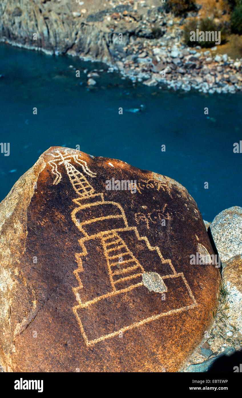 The ancient Alchi stones carved with pictures of stone stupas on a ...