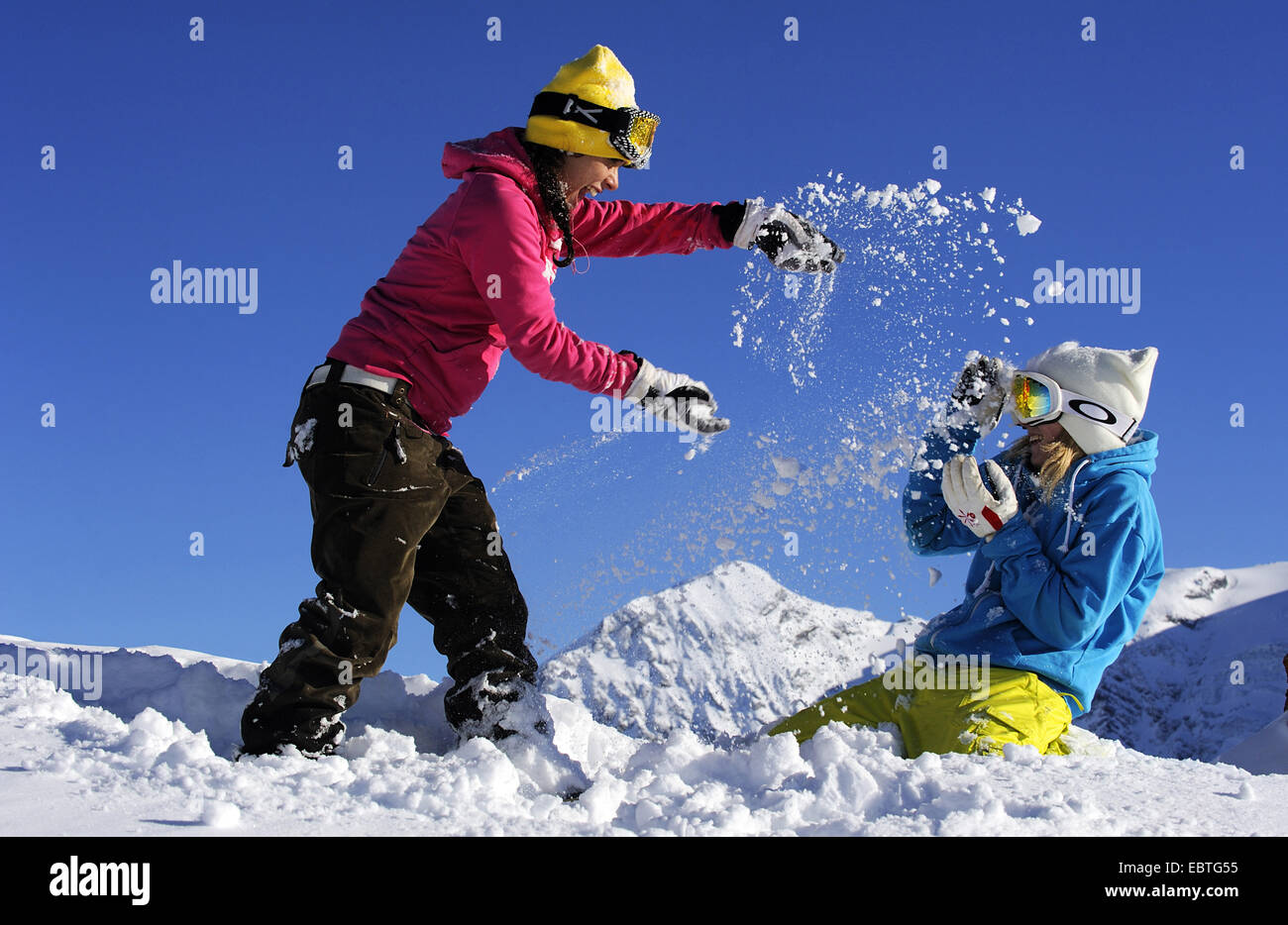 two teenage girls having a snow fight, France, Savoie Stock Photo - Alamy