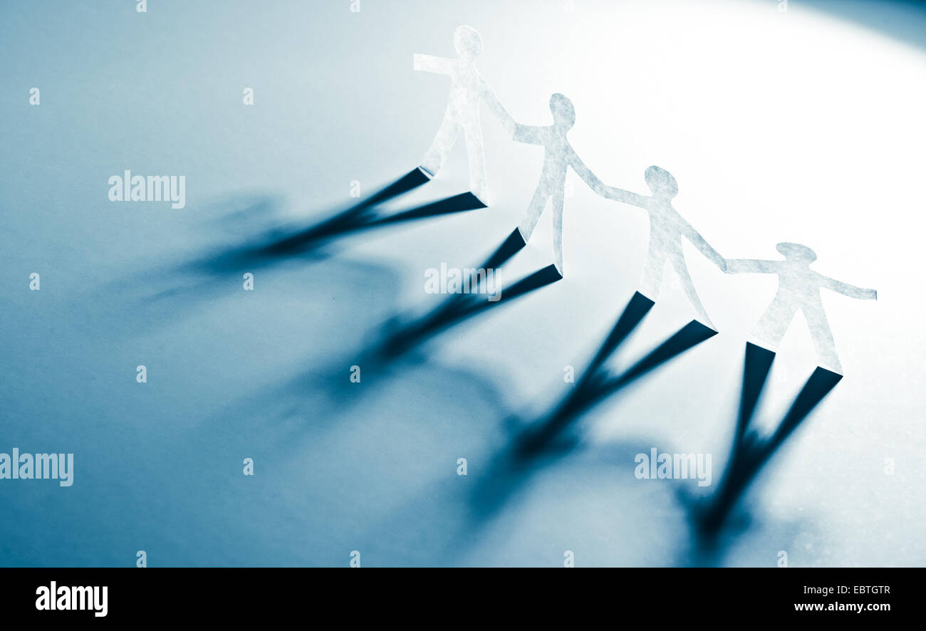 Paper people in teamworking concept Stock Photo - Alamy
