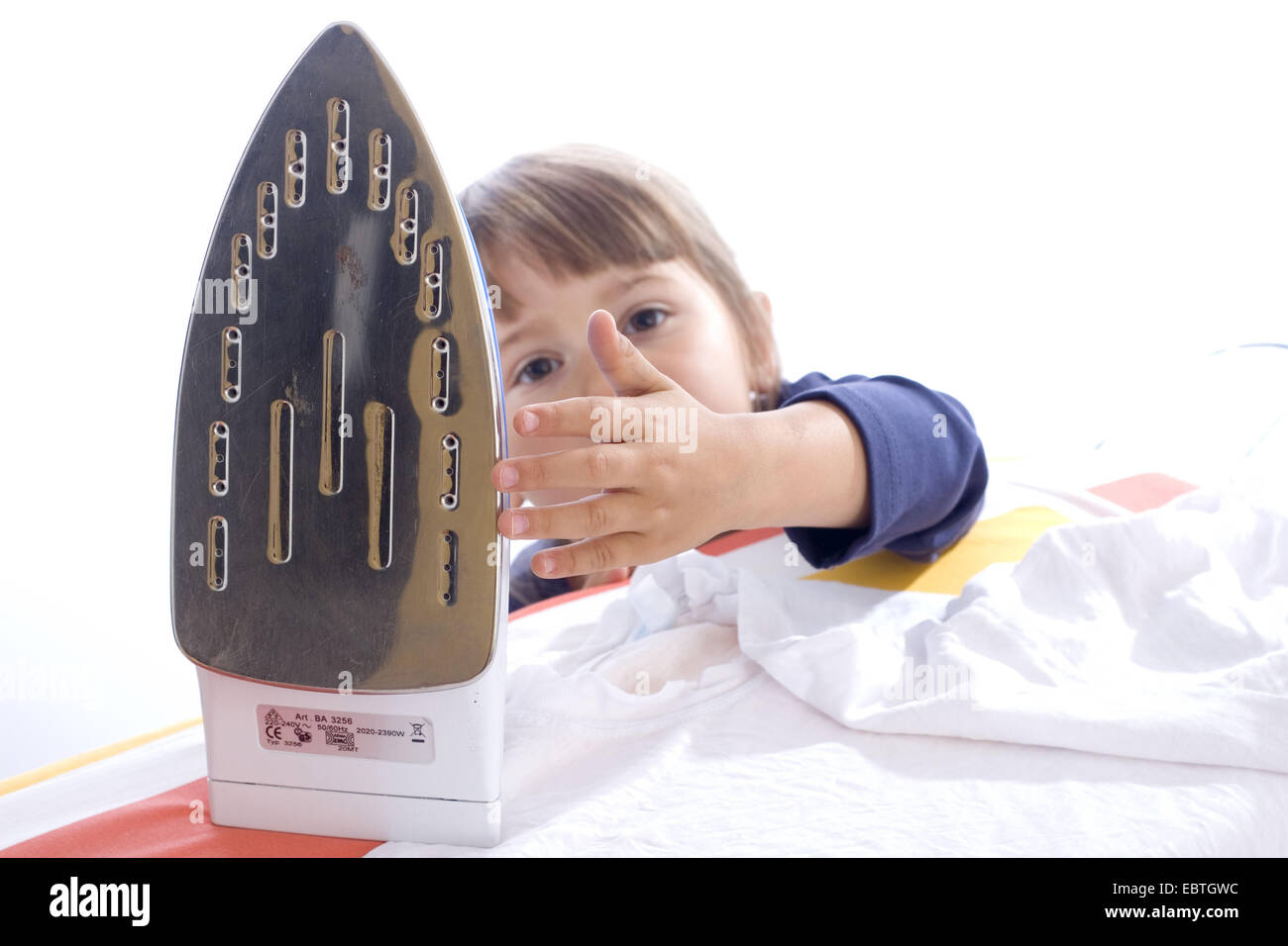Kid touch hot iron hi-res stock photography and images - Alamy