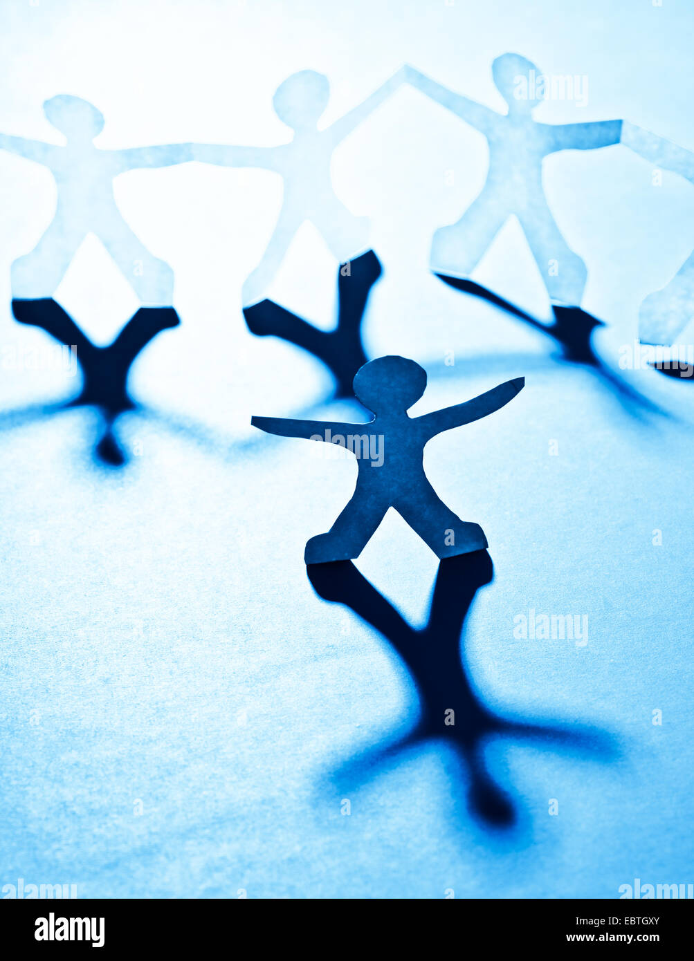 Paper people in teamworking concept Stock Photo - Alamy