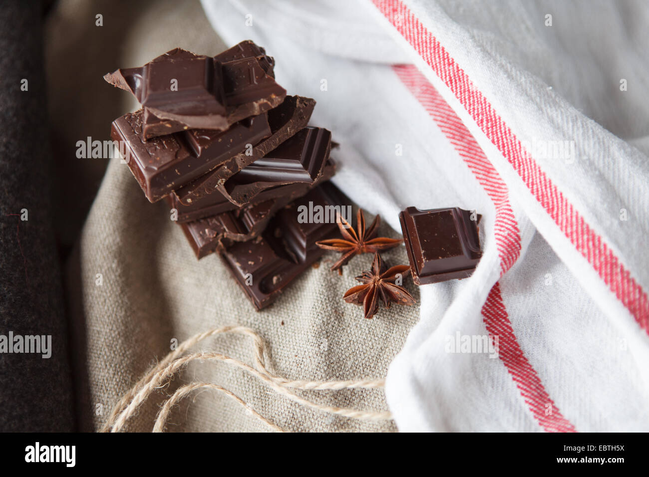 Broken chocolate bar and stars anise Stock Photo - Alamy