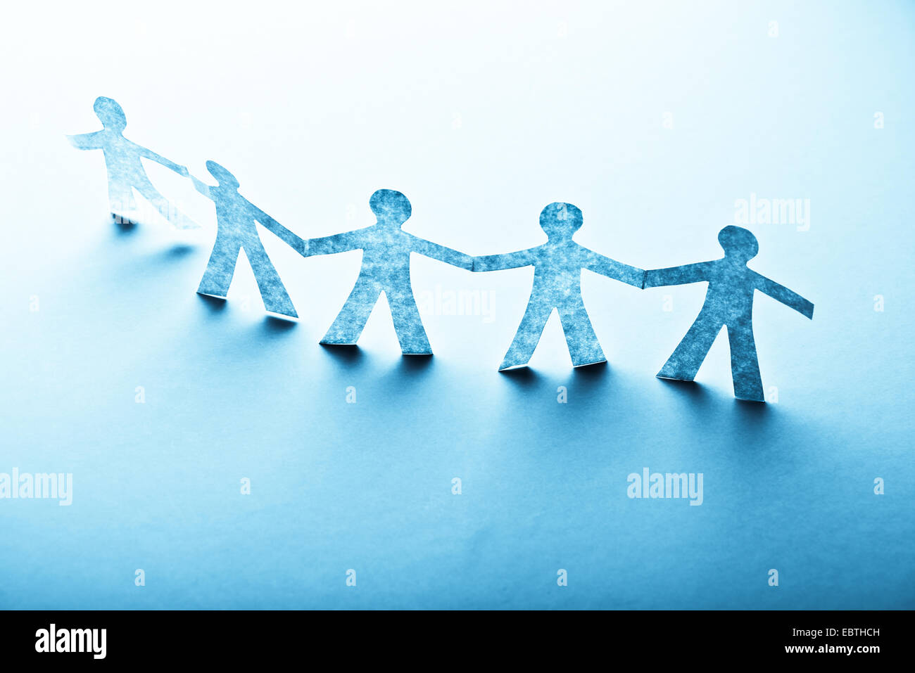 Paper people in teamworking concept Stock Photo - Alamy