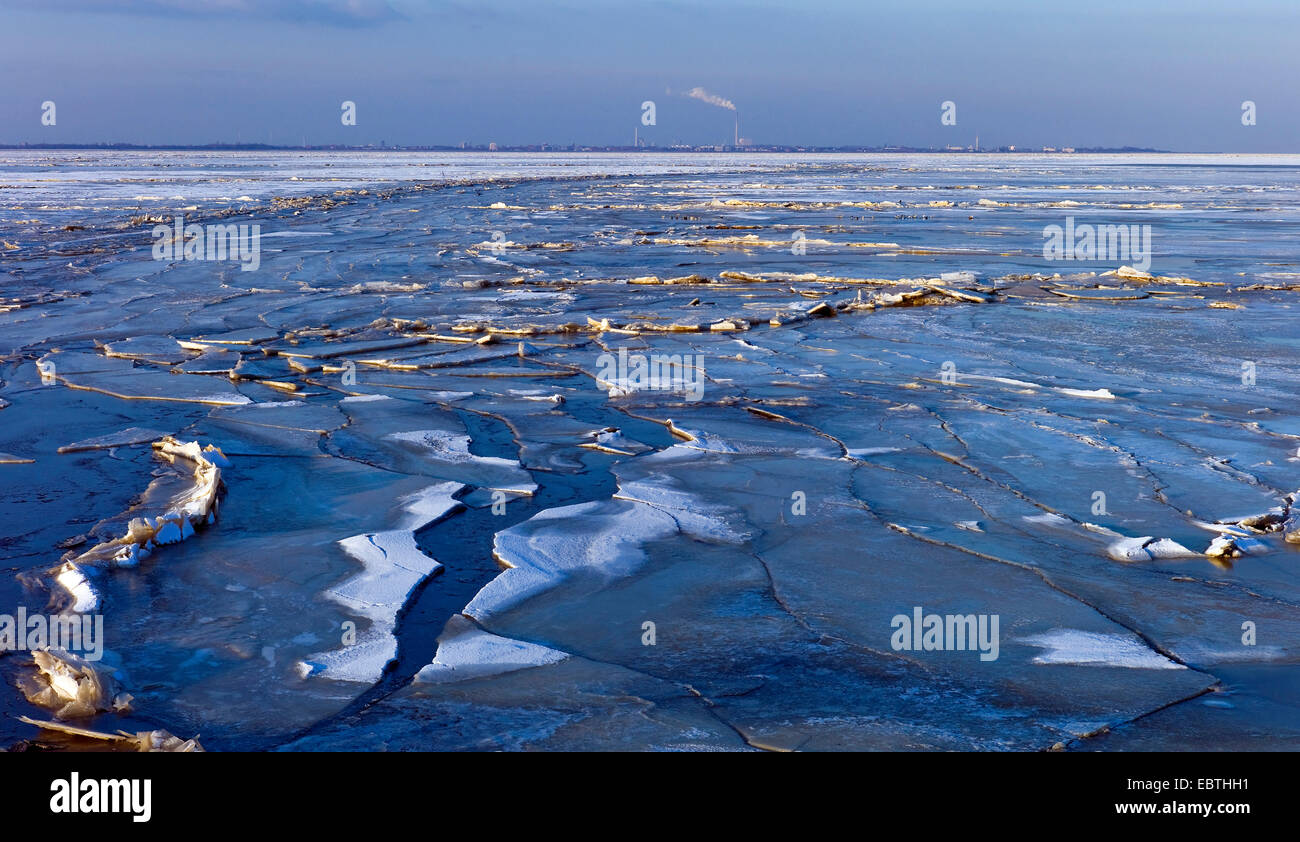 view over the beach with promenaders and the icy Jade Bay at ...