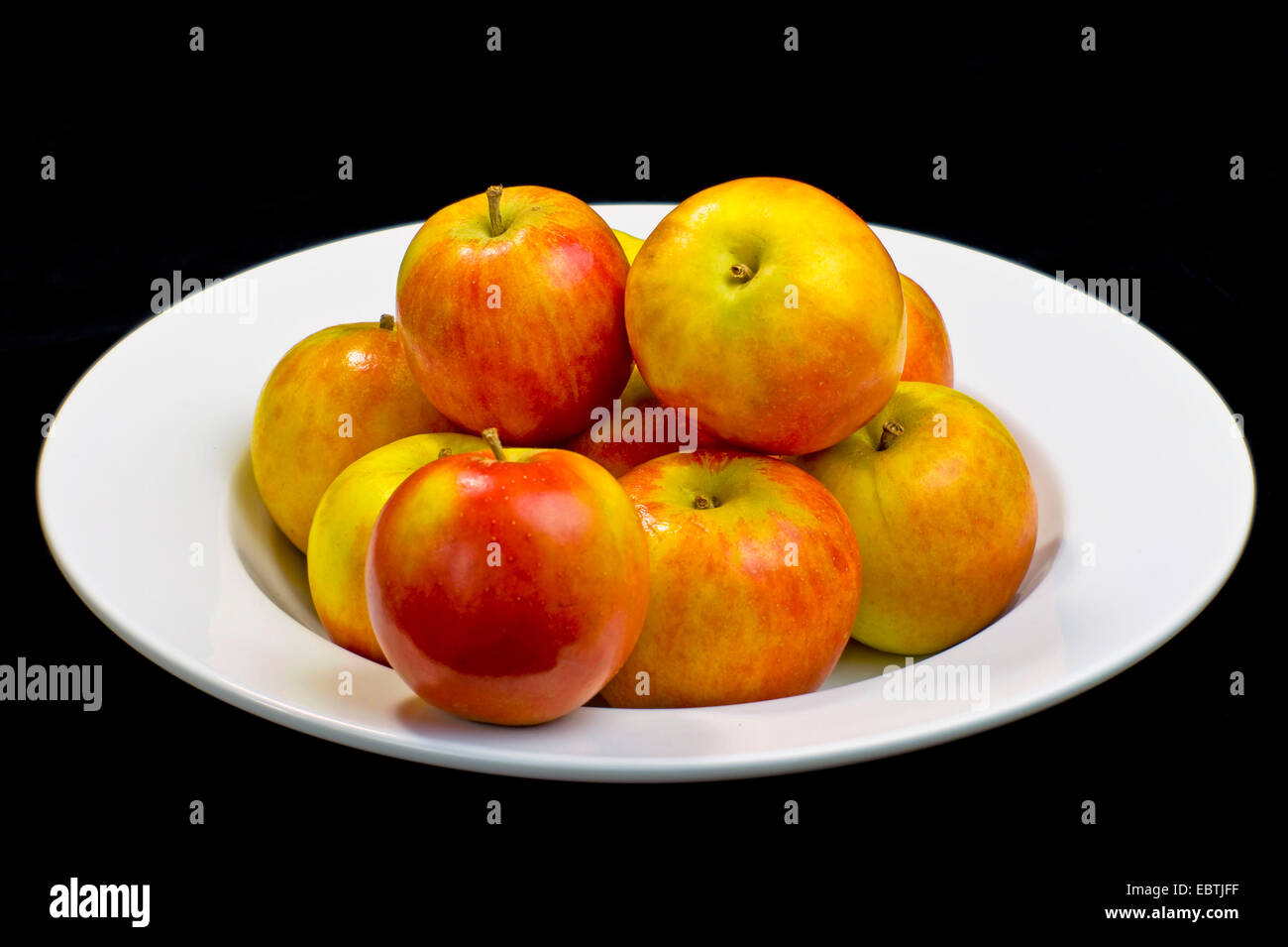 apple on a plate Stock Photo - Alamy