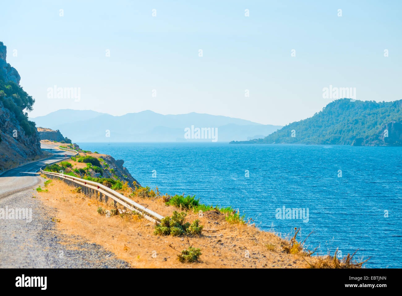 meandering mountain highway runs along the sea Stock Photo - Alamy