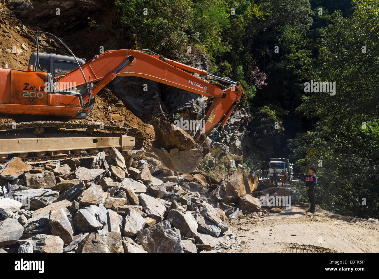 Road Crew working on removing rubble from Roads due to heavy rain in ...