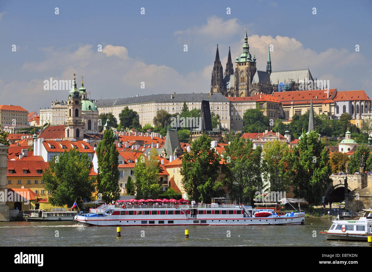 boat excursion ships on Vltava river with Prague castle on HradÞany ...