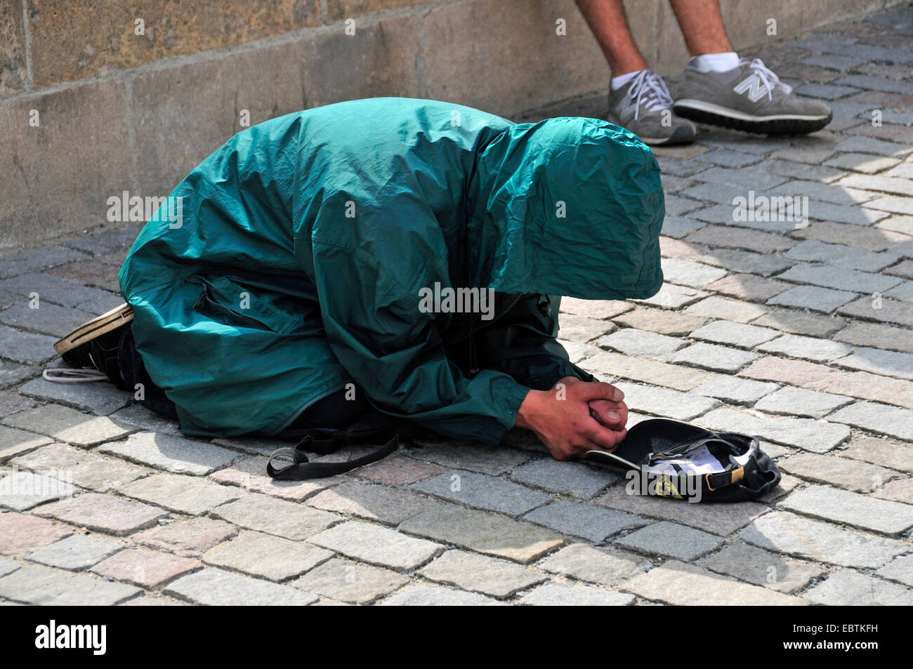 Man on knees begging in hi-res stock photography and images - Alamy