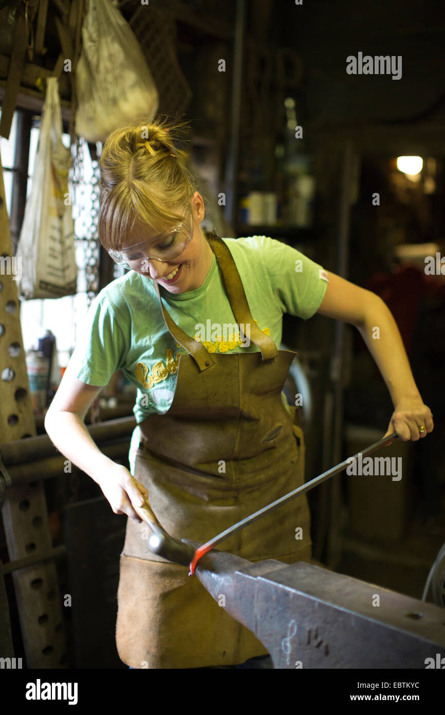 Woman blacksmith working in forge hi-res stock photography and images ...