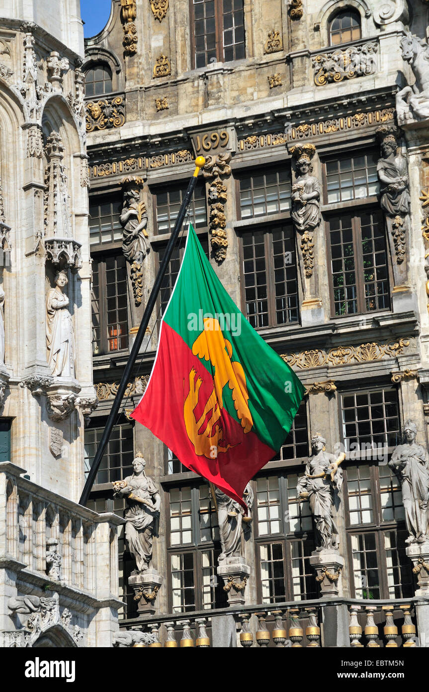 flag of Brussels at the facade of gothic town hall at Grand Place ...