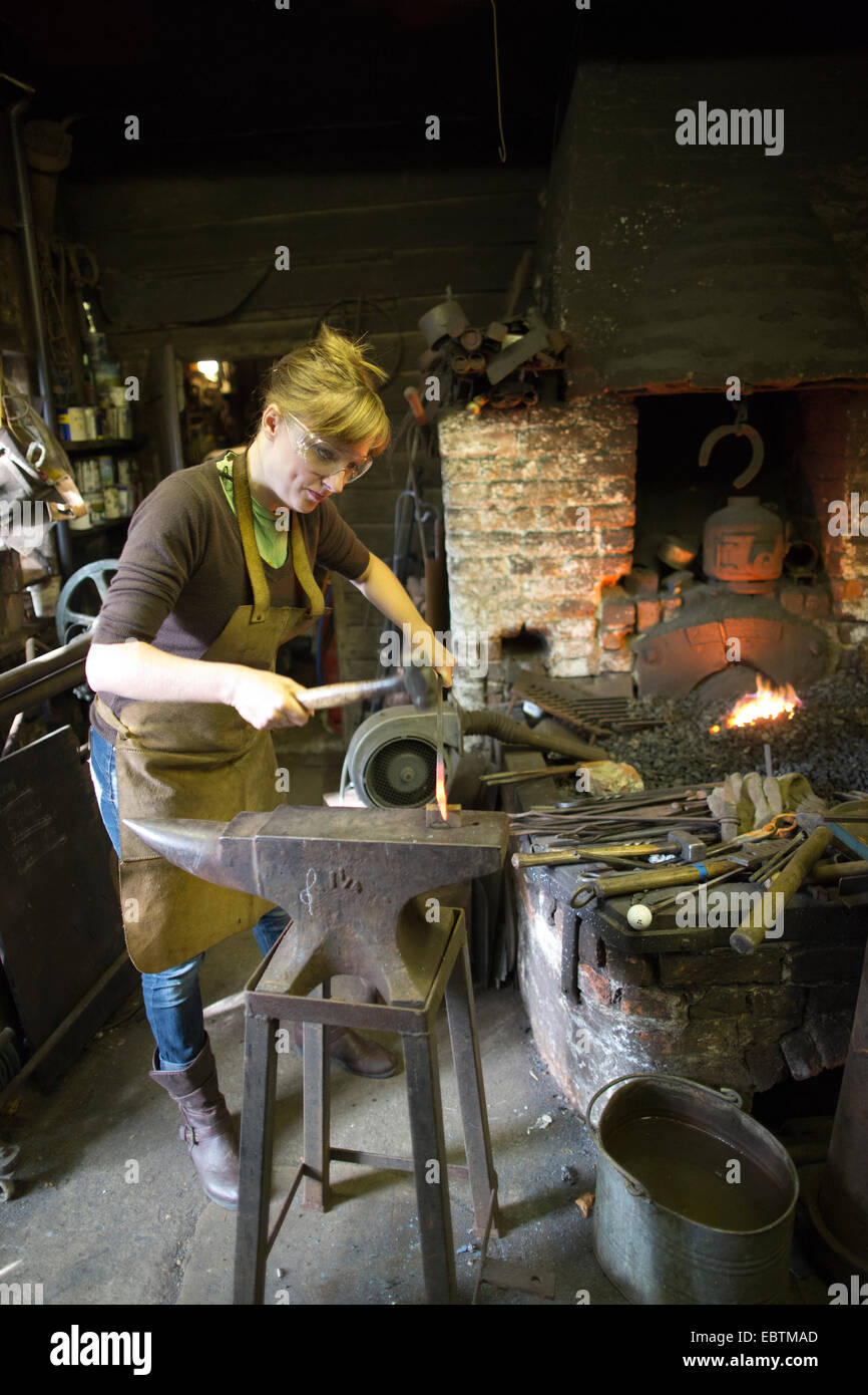 Woman blacksmith working in forge hi-res stock photography and images ...