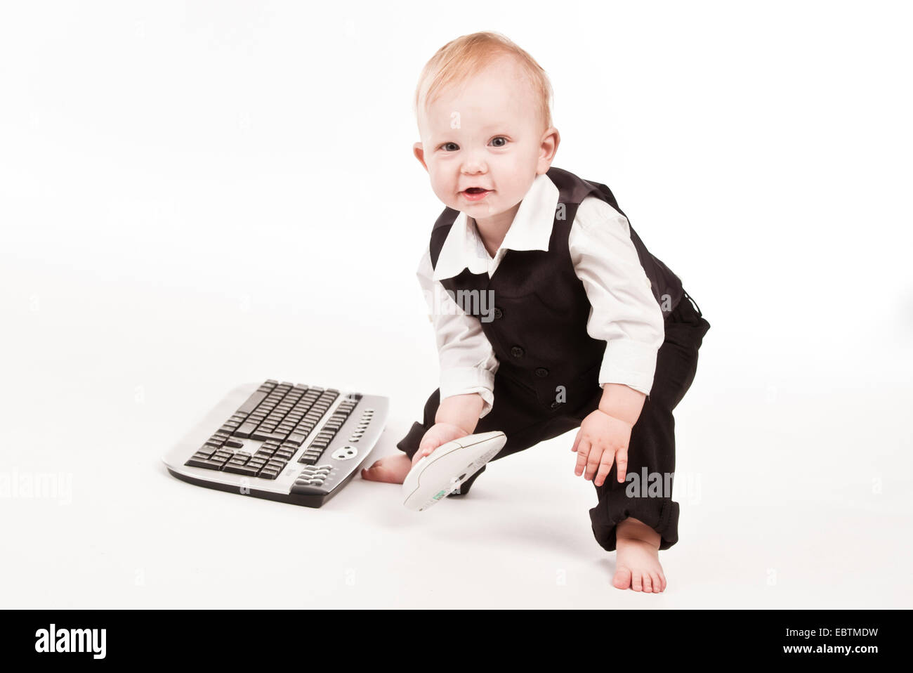 little child with computer keyboard and PC mouse Stock Photo - Alamy
