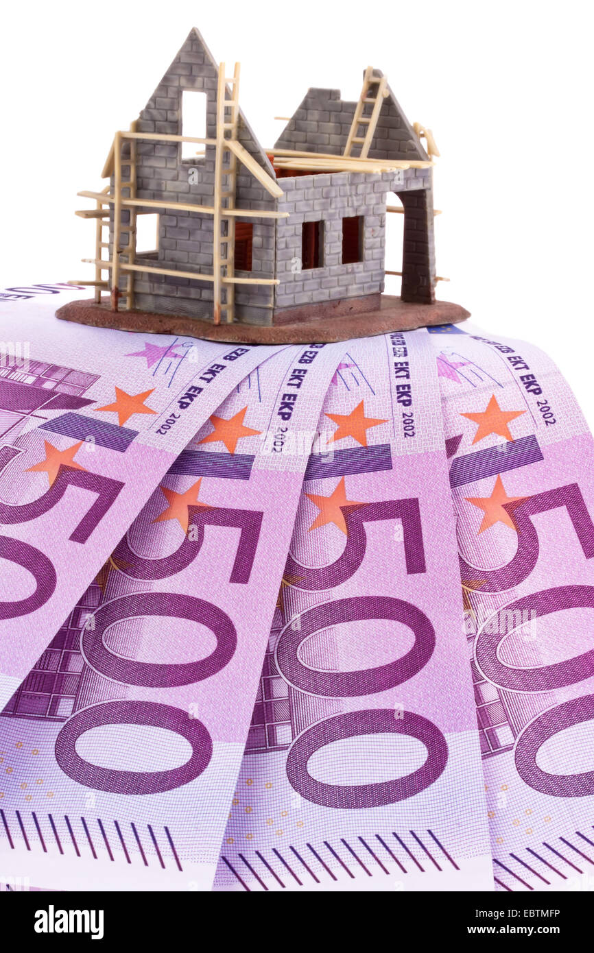 Euro notes and shell of a house Stock Photo - Alamy