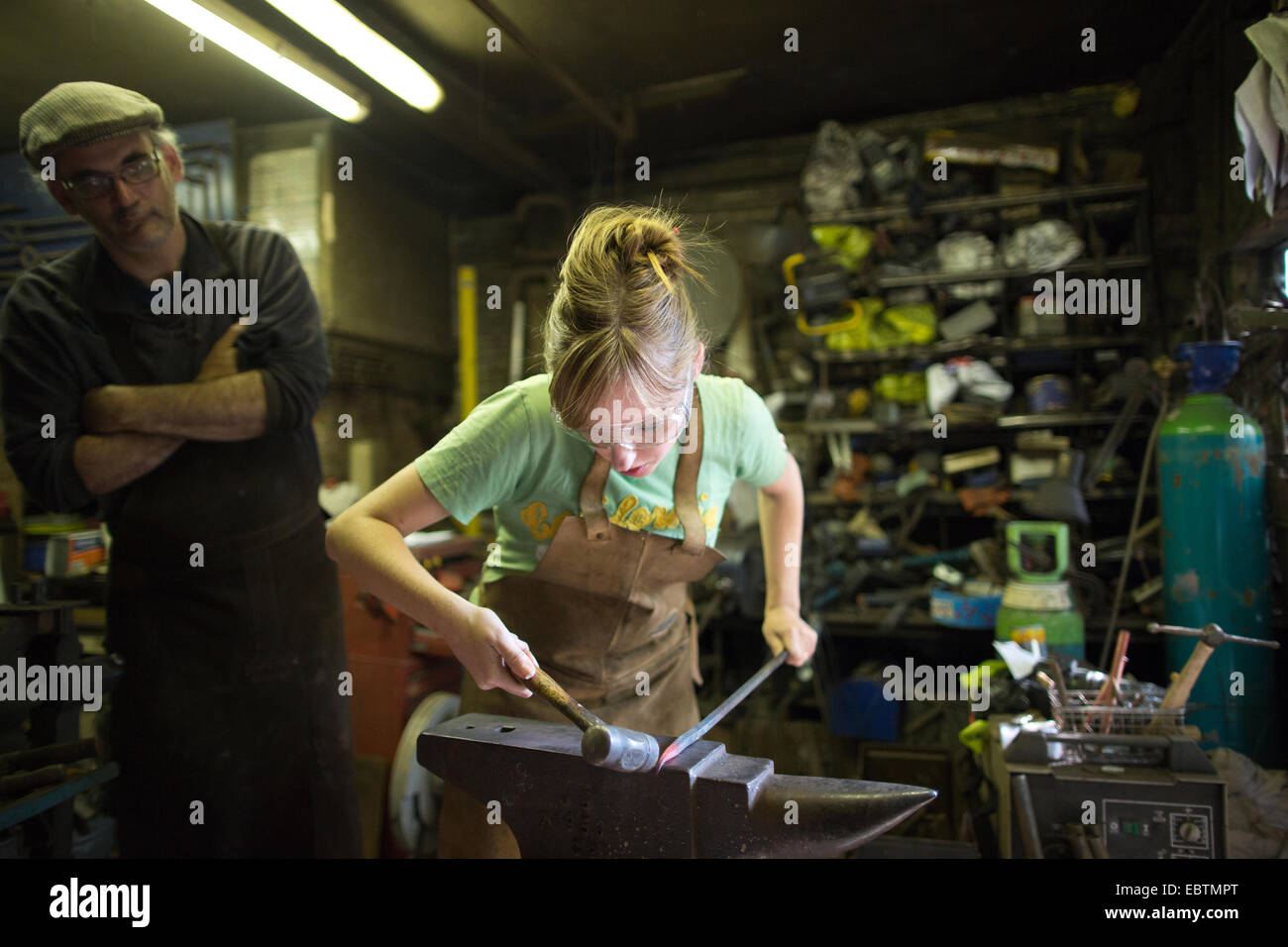 Woman blacksmith working in forge hi-res stock photography and images ...