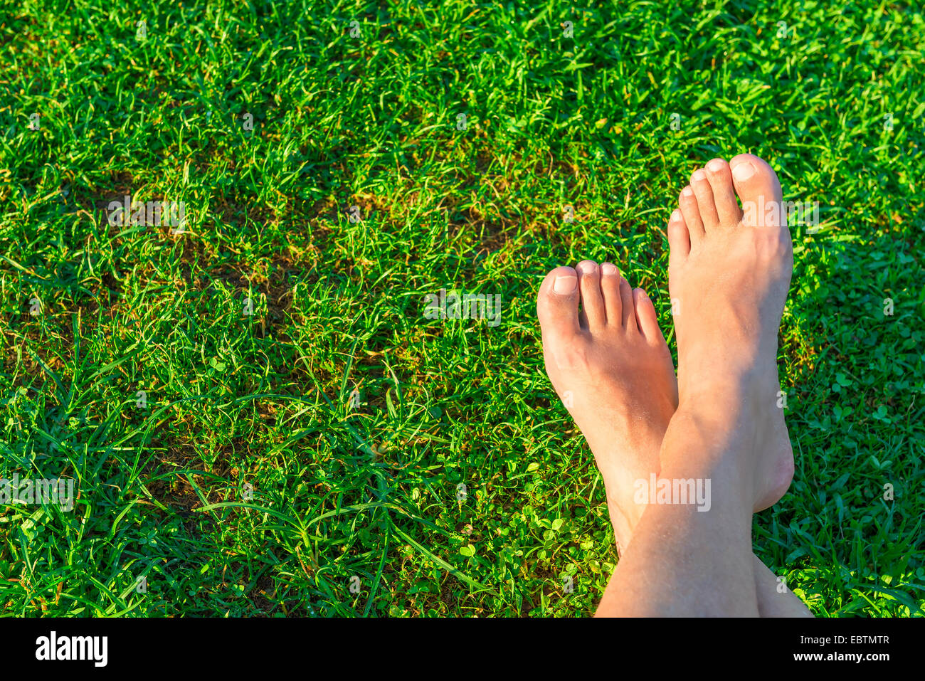 Grass lying feet hi-res stock photography and images - Alamy