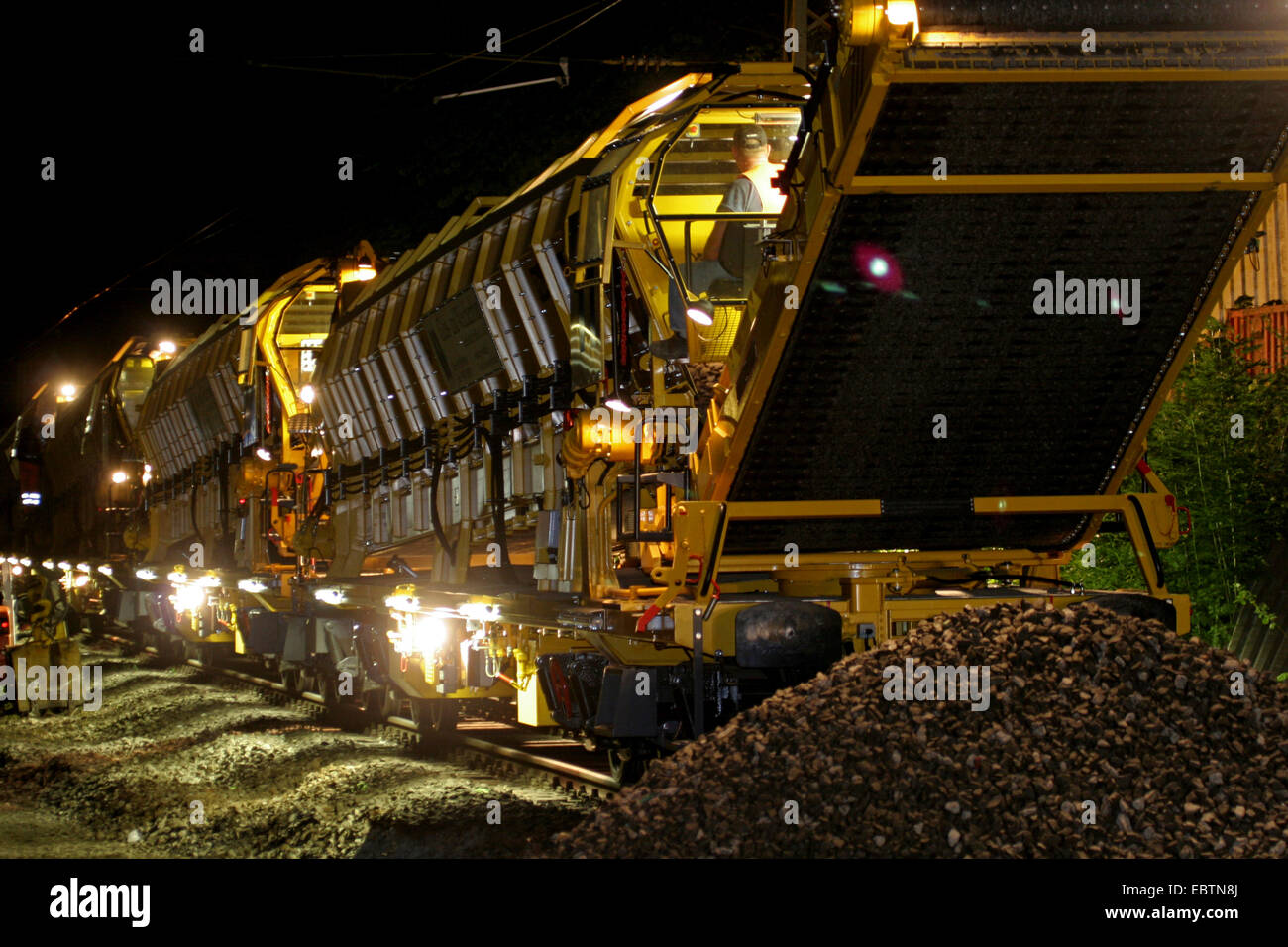 railway construction with hopper wagon at night, Germany, North Rhine ...