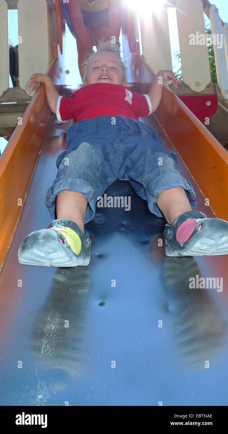 little boy happy on a slide Stock Photo - Alamy