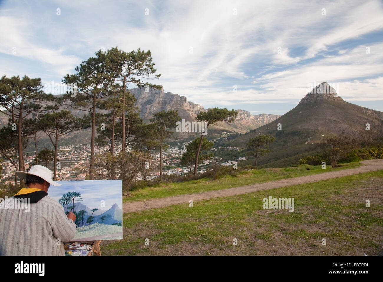 painter with easel painting Lion's Head and table mountain, South ...