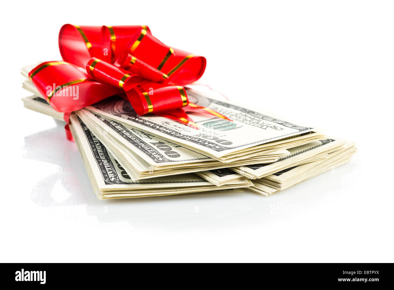 Money gift (big stack of dollars with red bow isolated on white ...