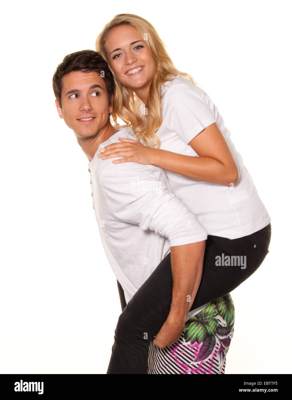 young couple in love, he is carrying her piggyback Stock Photo - Alamy